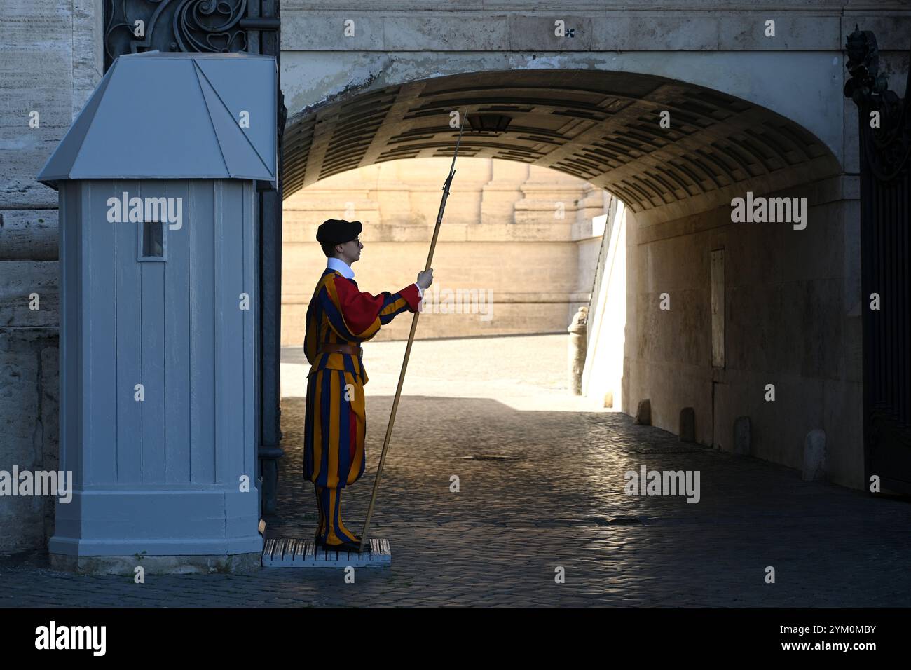 Vatican - November 2, 2024: A Papal Swiss Guard stands guard at the ...