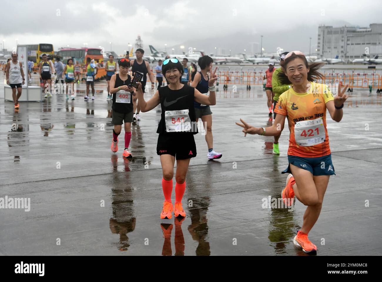People participate in a running event to celebrate the upcoming launch ...