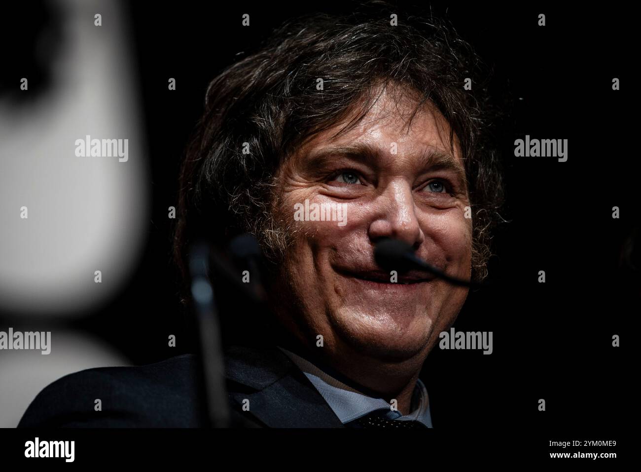 Javier Milei smiles to the audience at his campaign closing event ...