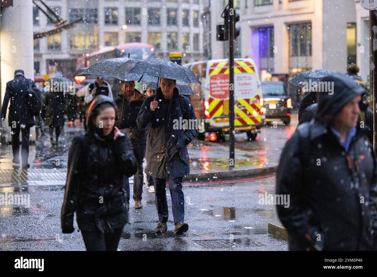 London city commuters make their way along Gracechurch Street as a cold ...