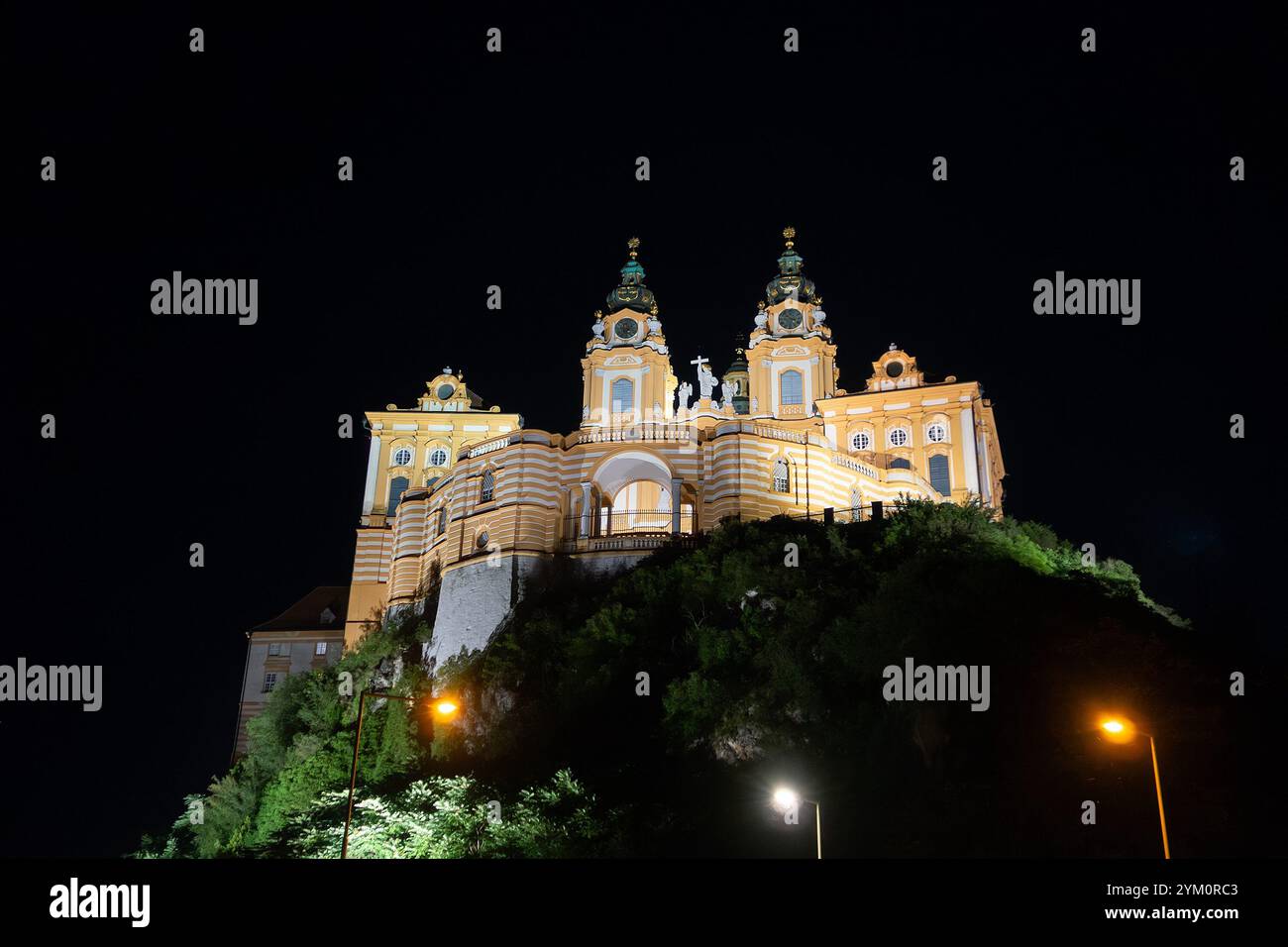 Melk Abbey castle in Austria, huge orange baroque building at black ...