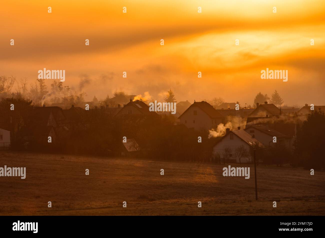 Air pollution from burning solid fuel in rural family homes Stock Photo ...