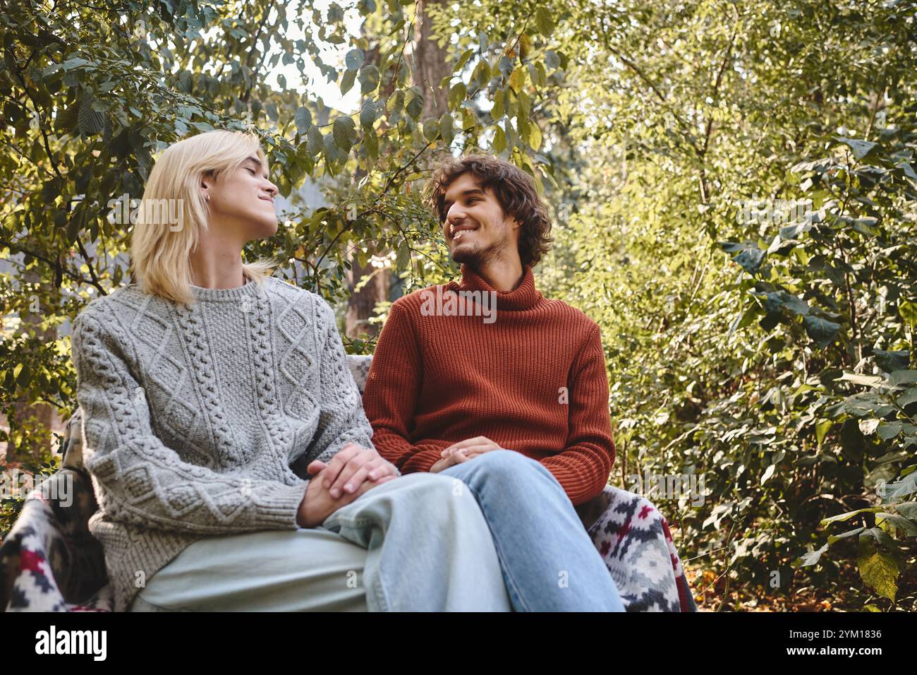 Joyful young couple embraces hi-res stock photography and images - Alamy