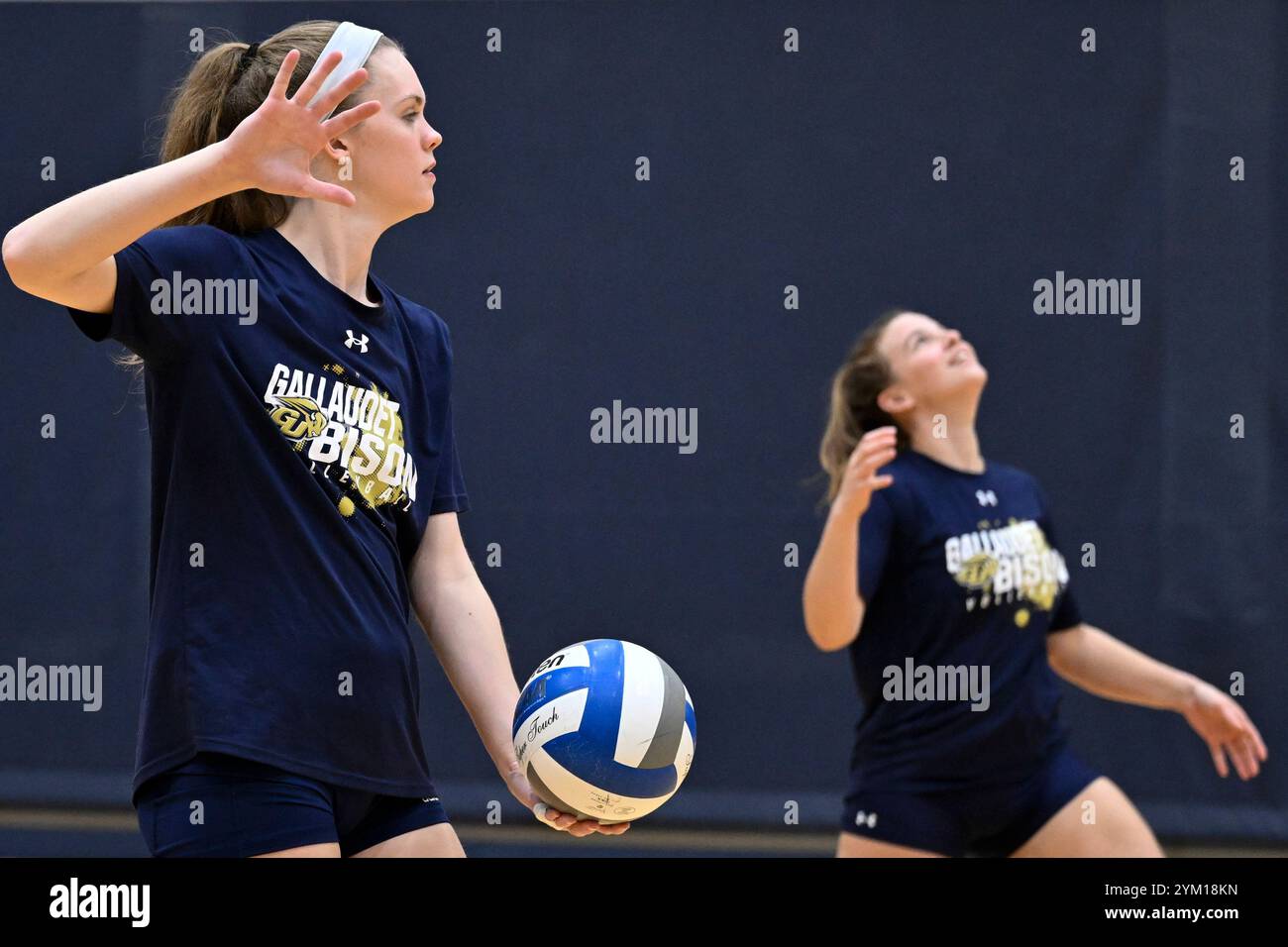 Gallaudet women's volleyball player Brielle Worley, left, prepare to ...