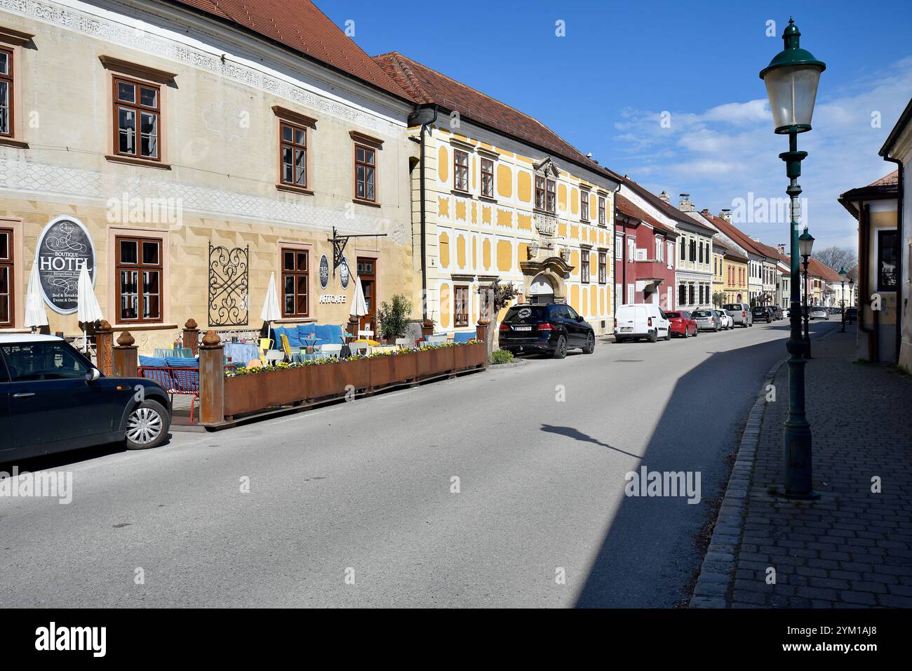 Rust, Austria - March 23, 2024: Main street with parking cars in the so ...