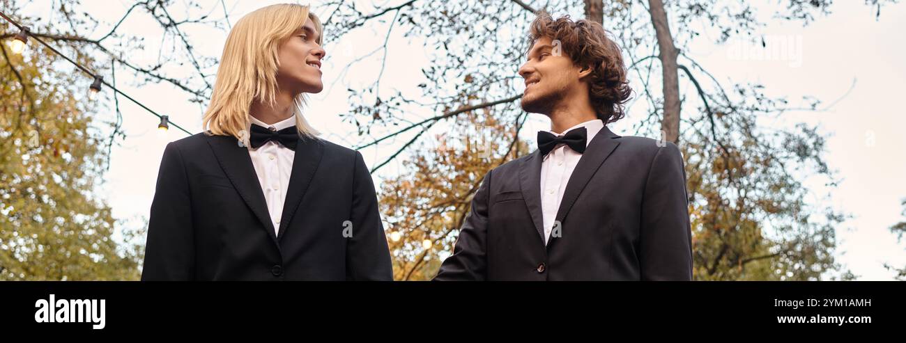 Two young men stand together, radiating joy and connection while ...