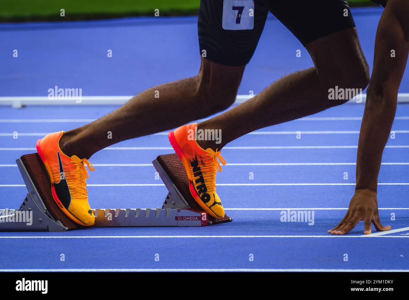 Orange Puma athletic shoes in the 400 meters at the Paris 2024 Olympic ...