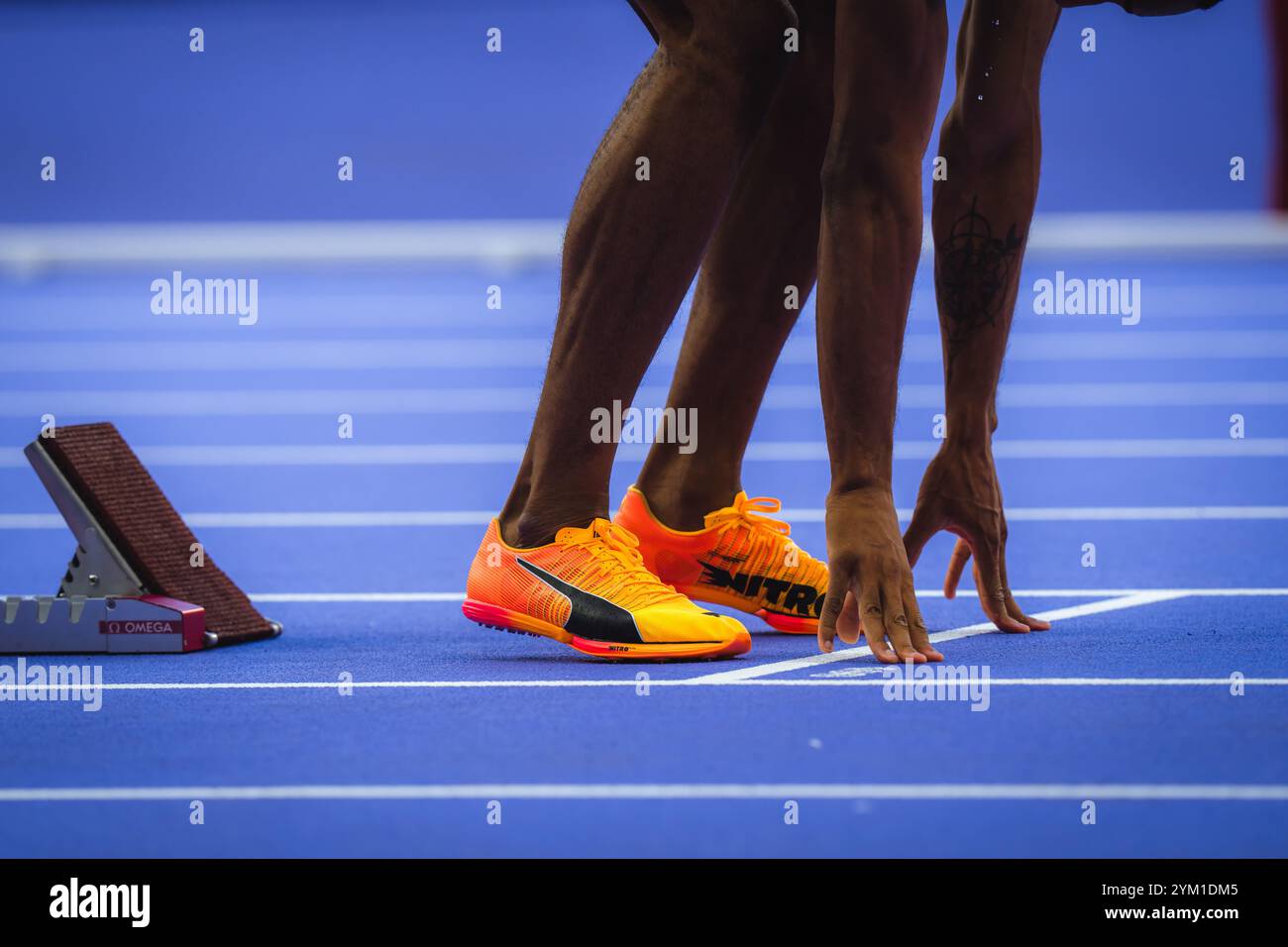Orange Puma athletic shoes in the 400 meters at the Paris 2024 Olympic ...