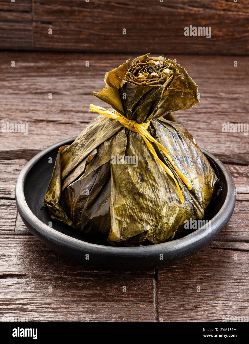 Traditional Colombian tamales - Wrapped in green banana leaves Stock ...