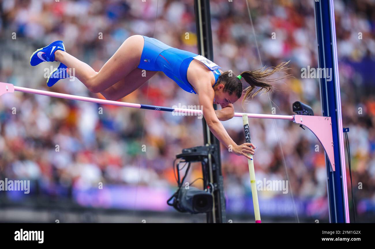Elisa Molinarolo participating in the pole vault at the Paris 2024 ...
