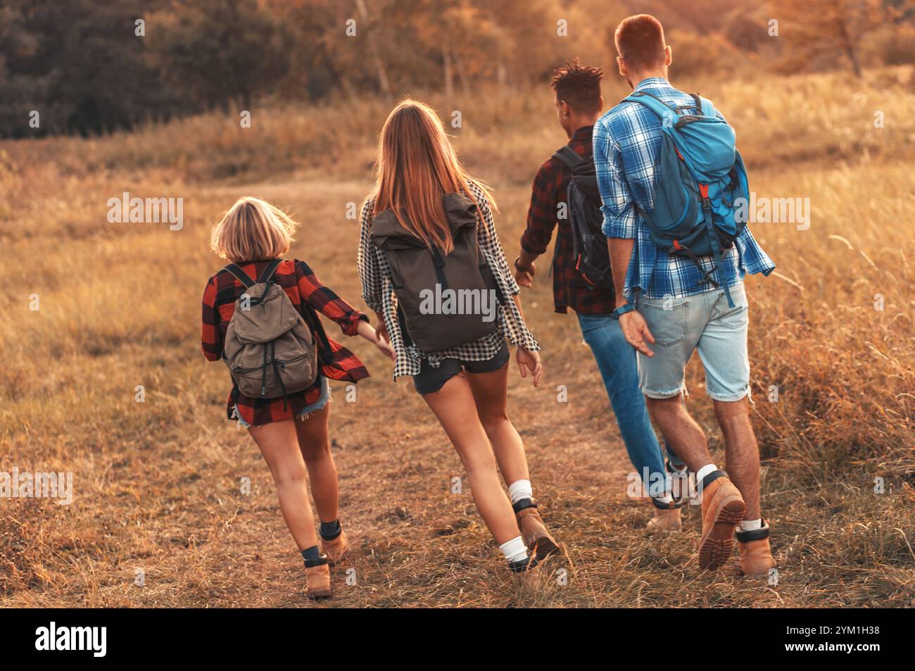 Happy multiracial friends travel hiking hi-res stock photography and ...