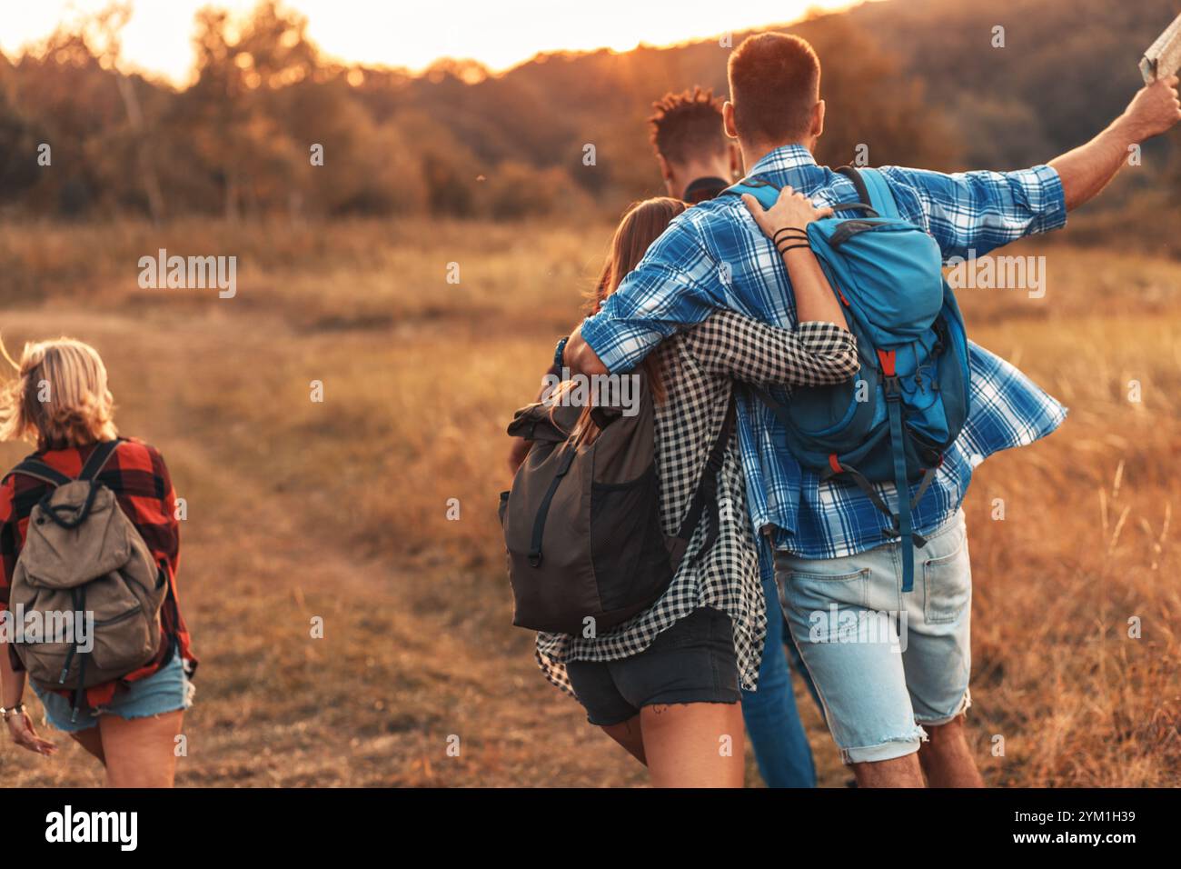Happy multiracial friends travel hiking hi-res stock photography and ...