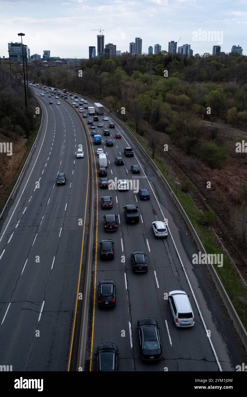 Fast road with car traffic with side of the park Rosedale Ravine Lands ...