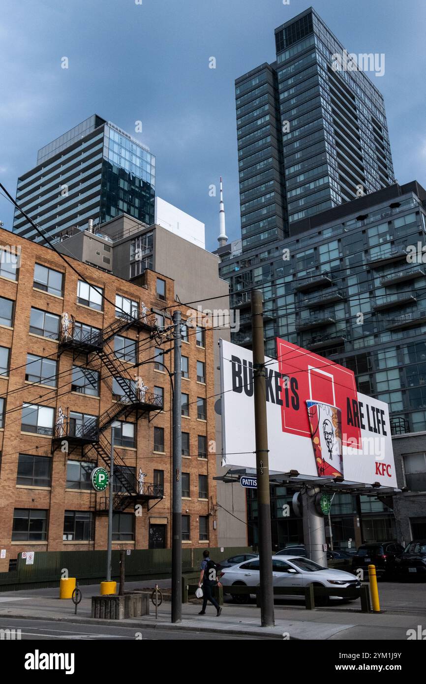 Advertisement for KFC (Kentucky Fried Chicken) below a high-rise tower ...