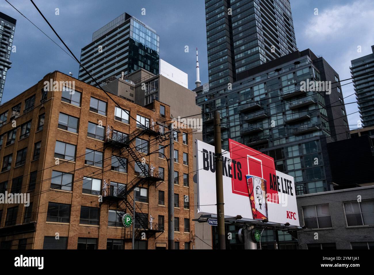 Advertisement for KFC (Kentucky Fried Chicken) below a high-rise tower ...