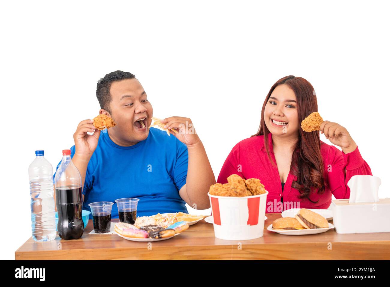 Friends are enjoying a fast food meal together, featuring fried chicken ...
