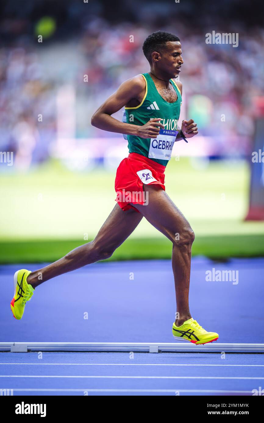Hagos Gebrhiwet participating in the 5000 meters at the Paris 2024 ...