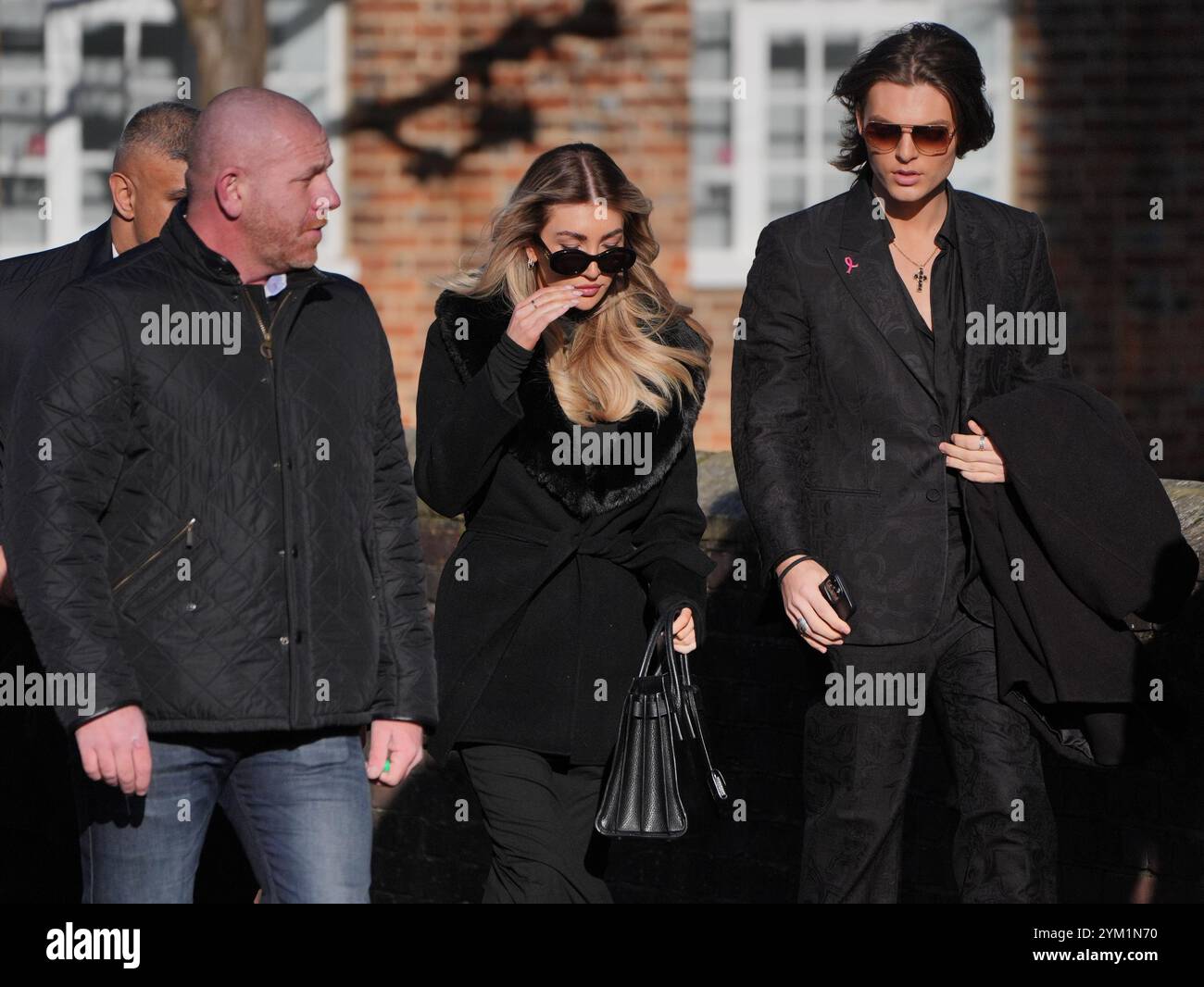 Kate Cassidy and Damian Hurley (right) arrives for the funeral service ...
