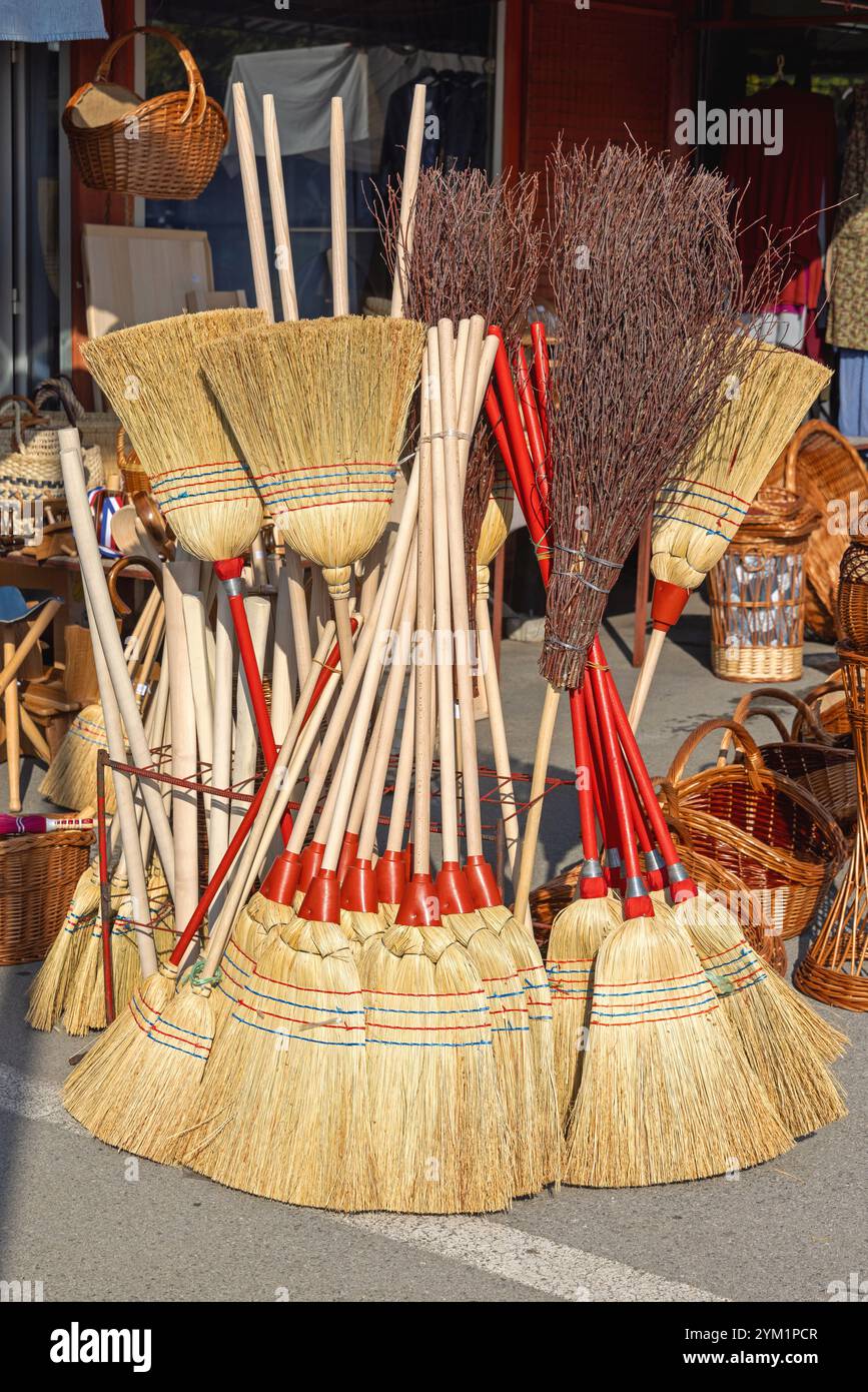 Bunch of Sorghum Brooms With Long Handles at Market Stock Photo - Alamy