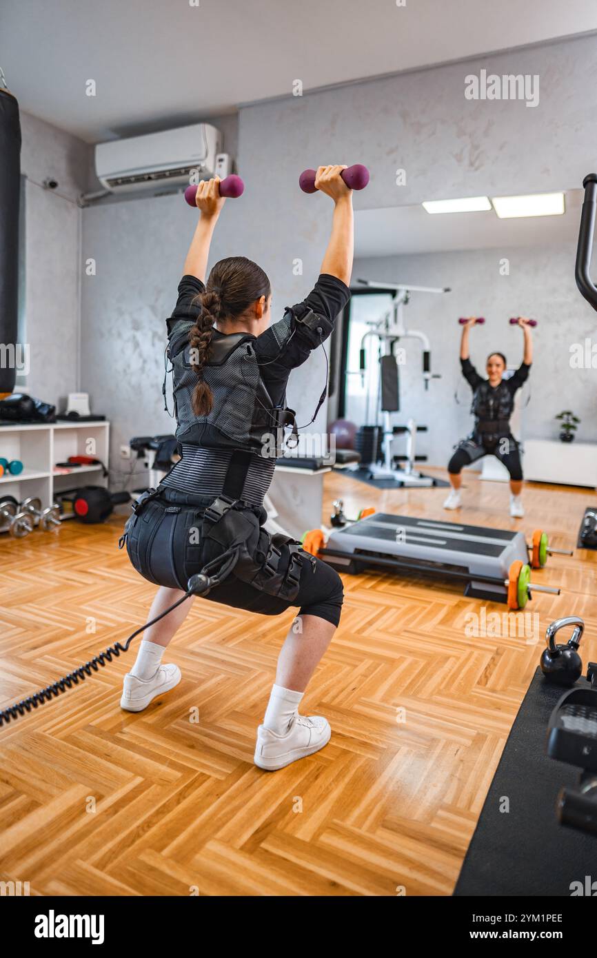 Full-body indoor workout with new training gear Stock Photo - Alamy