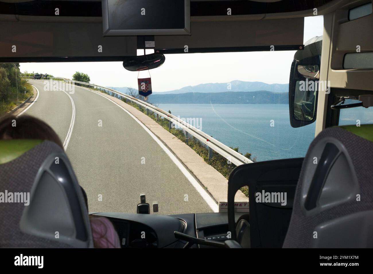 Drivers windscreen view from a public coach journey; bus driving on the ...