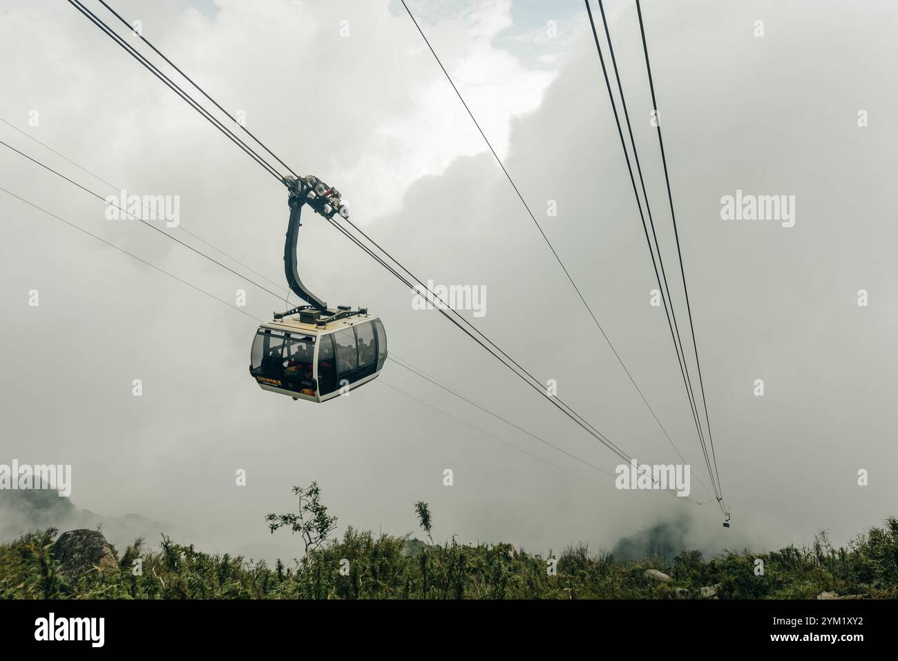 Sapa, Vietnam - March 28, 2024: Cable car in the Fansipan mountain ...