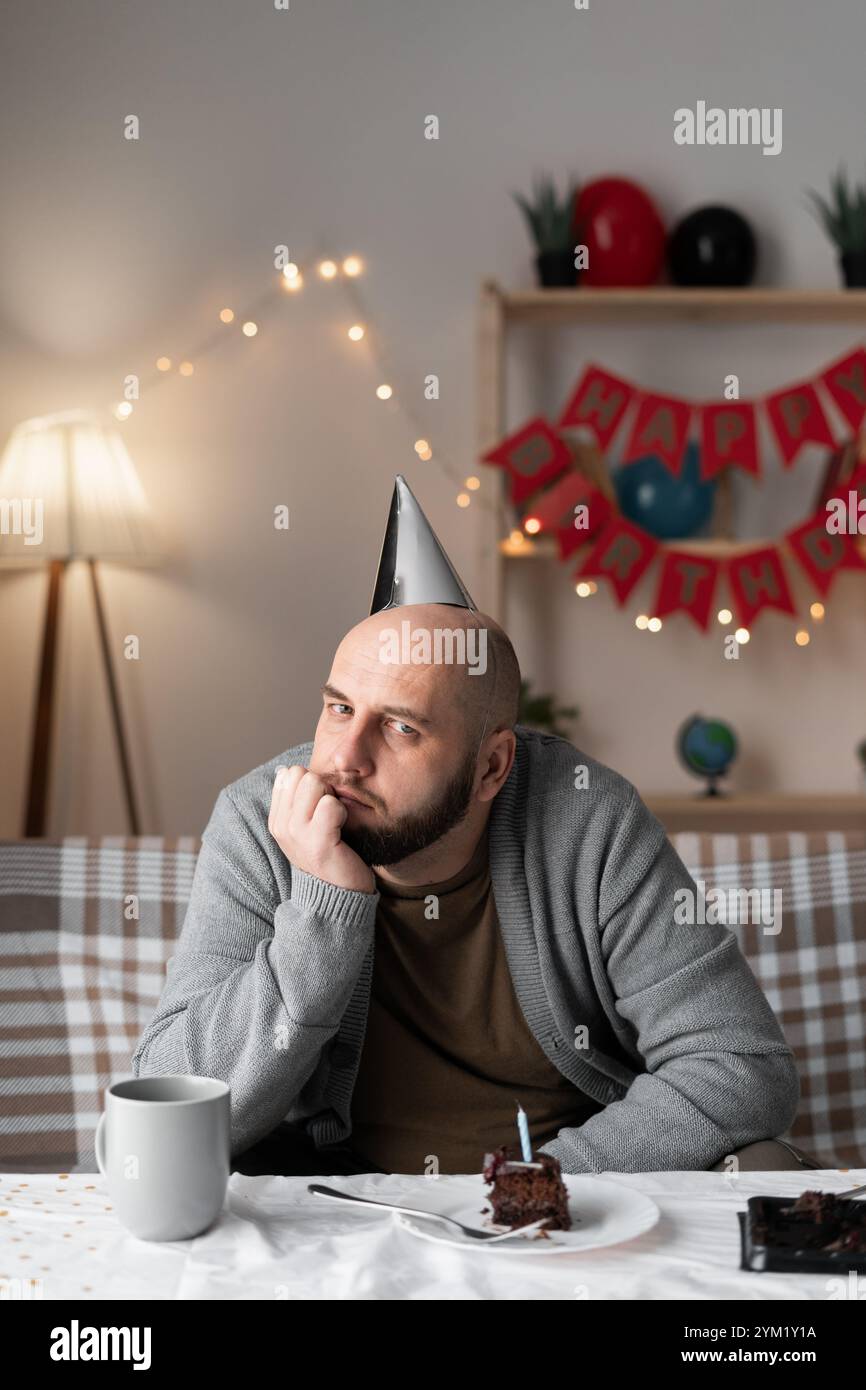 Sad young man sitting candle hi-res stock photography and images - Alamy