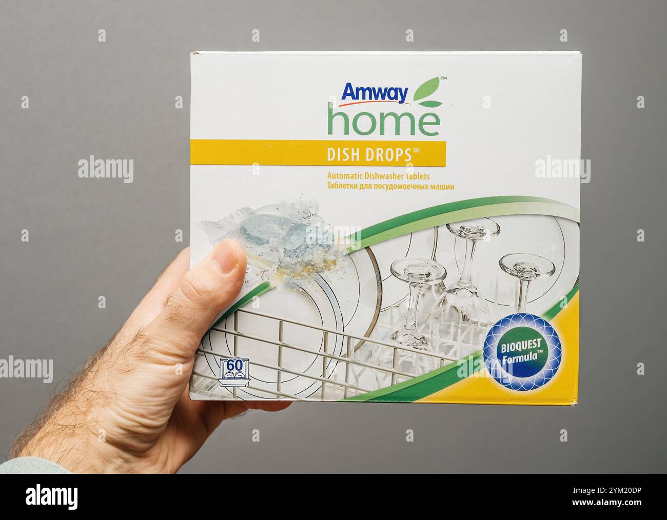 Paris, France - Mar 26, 2020: POV shot of a hand holding a box of Amway ...