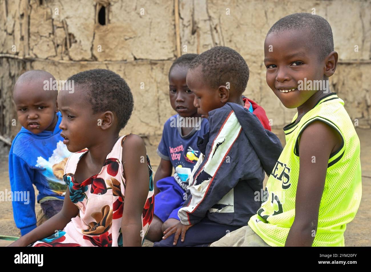 A SUBURB OF NAIROBI, KENYA - NOVEMBER 14, 2022: Group of African little ...