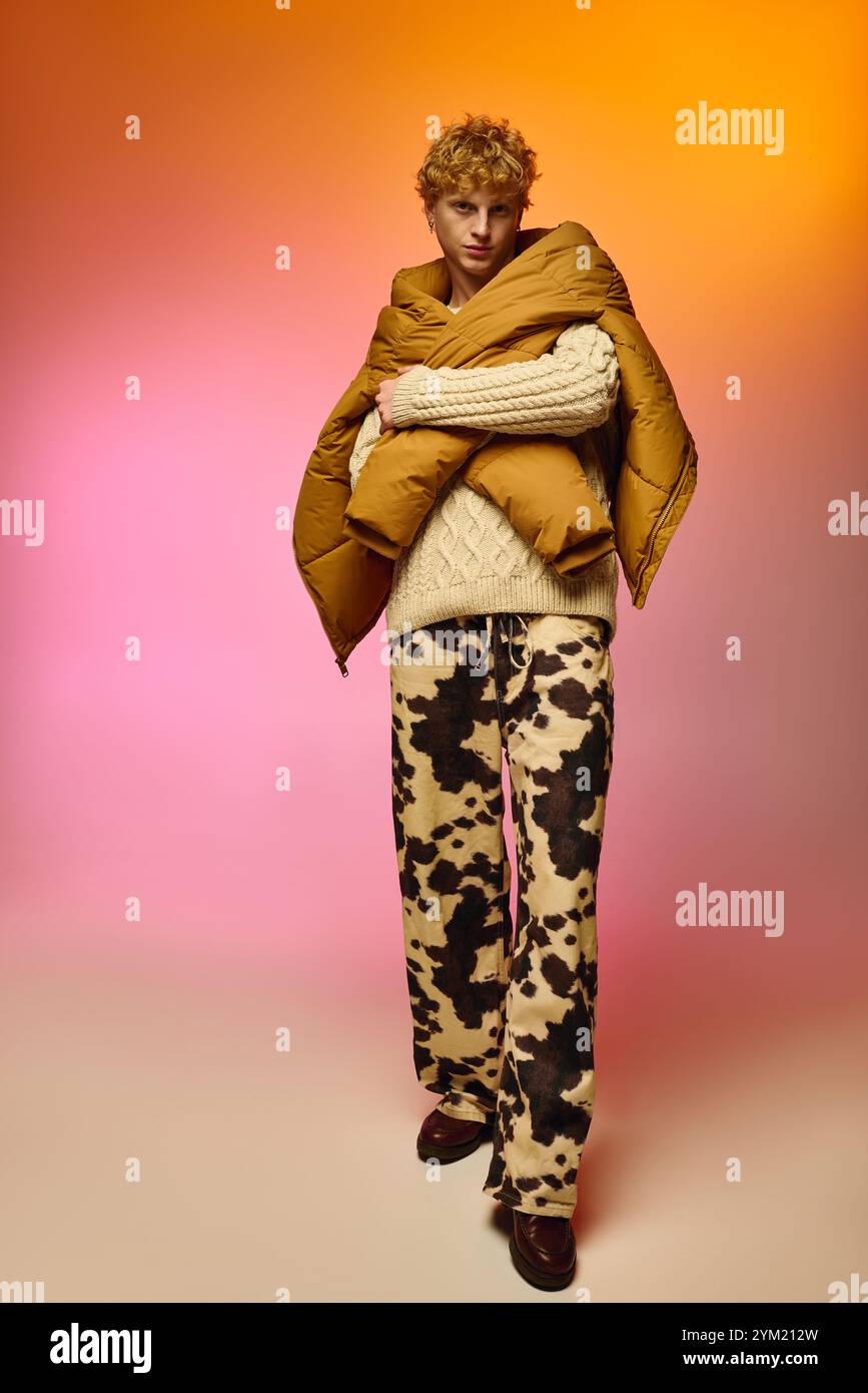 A stylish man showcases a daring Christmas outfit featuring a knitted ...