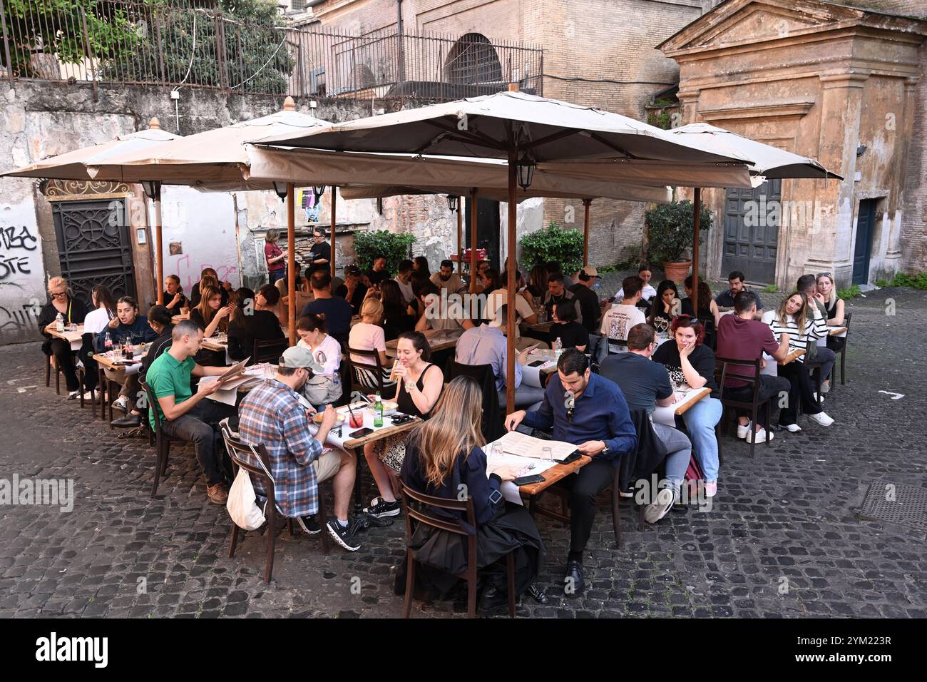 Rome, Italy - October 31, 2024: People relax in a cafe in the ...