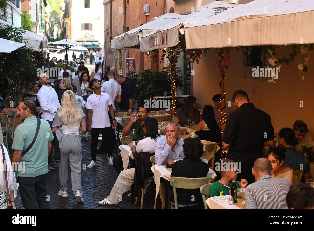 Rome, Italy - October 31, 2024: People relax in a cafe in the ...