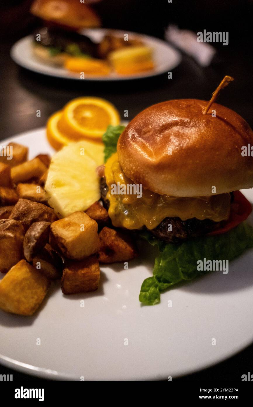 Burger with potatoes for lunch in a pub restaurant in the Downtown ...