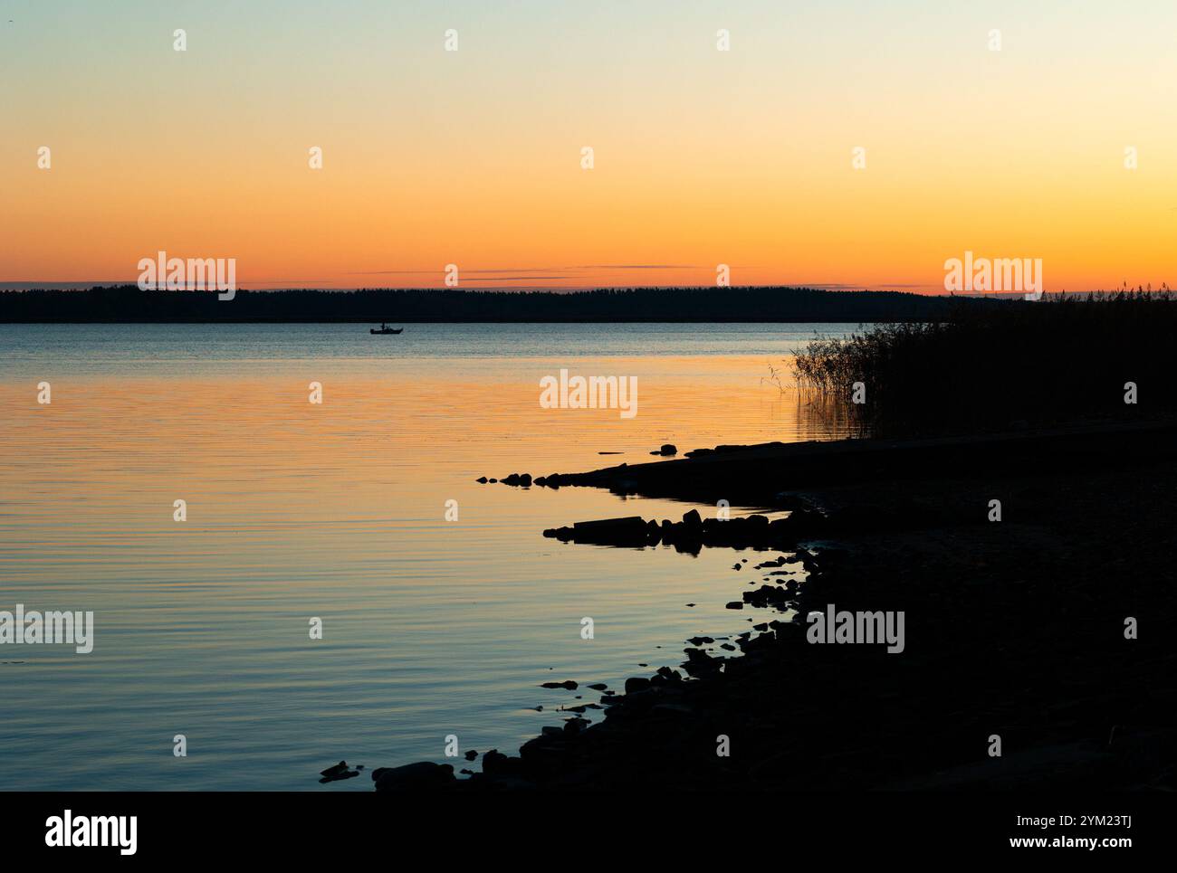 Beautiful early autumn sunrise at the lakeside in Latvia. Seasonal ...