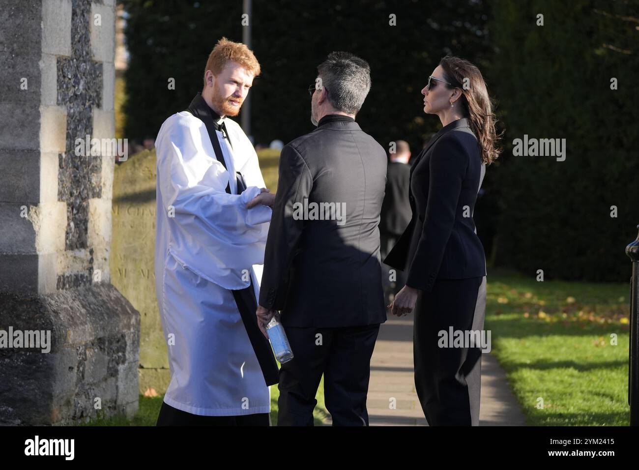 Simon Cowell (centre) and Lauren Silverman (right) after the funeral ...
