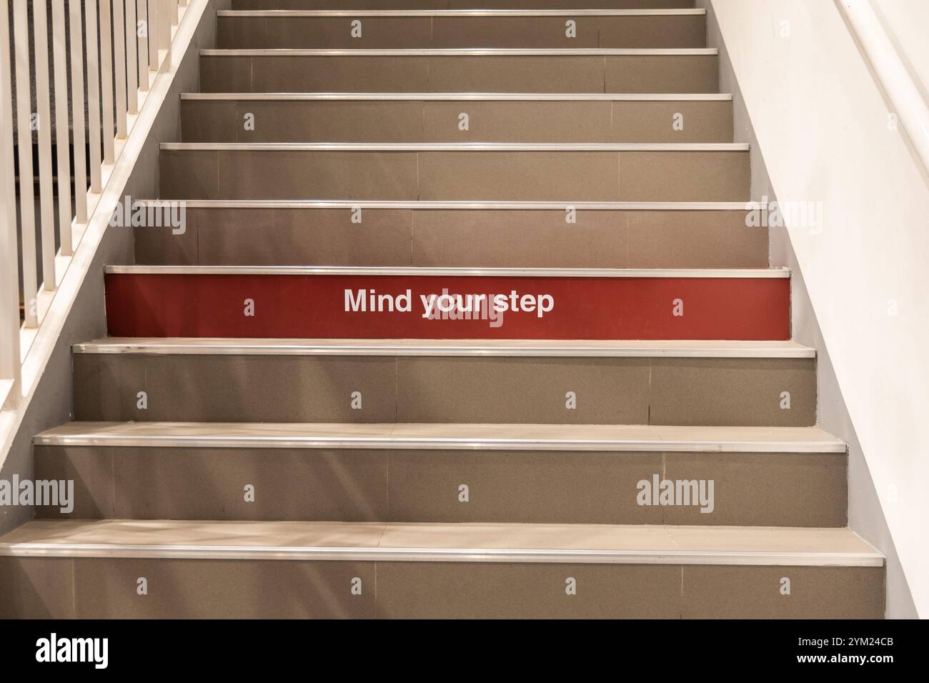 Mind your step precaution message printed on step on staircase Stock ...