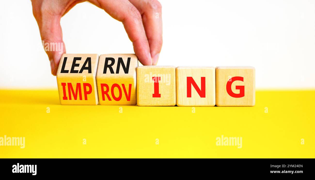 Improving or learning symbol. Businessman turns wooden cubes and ...