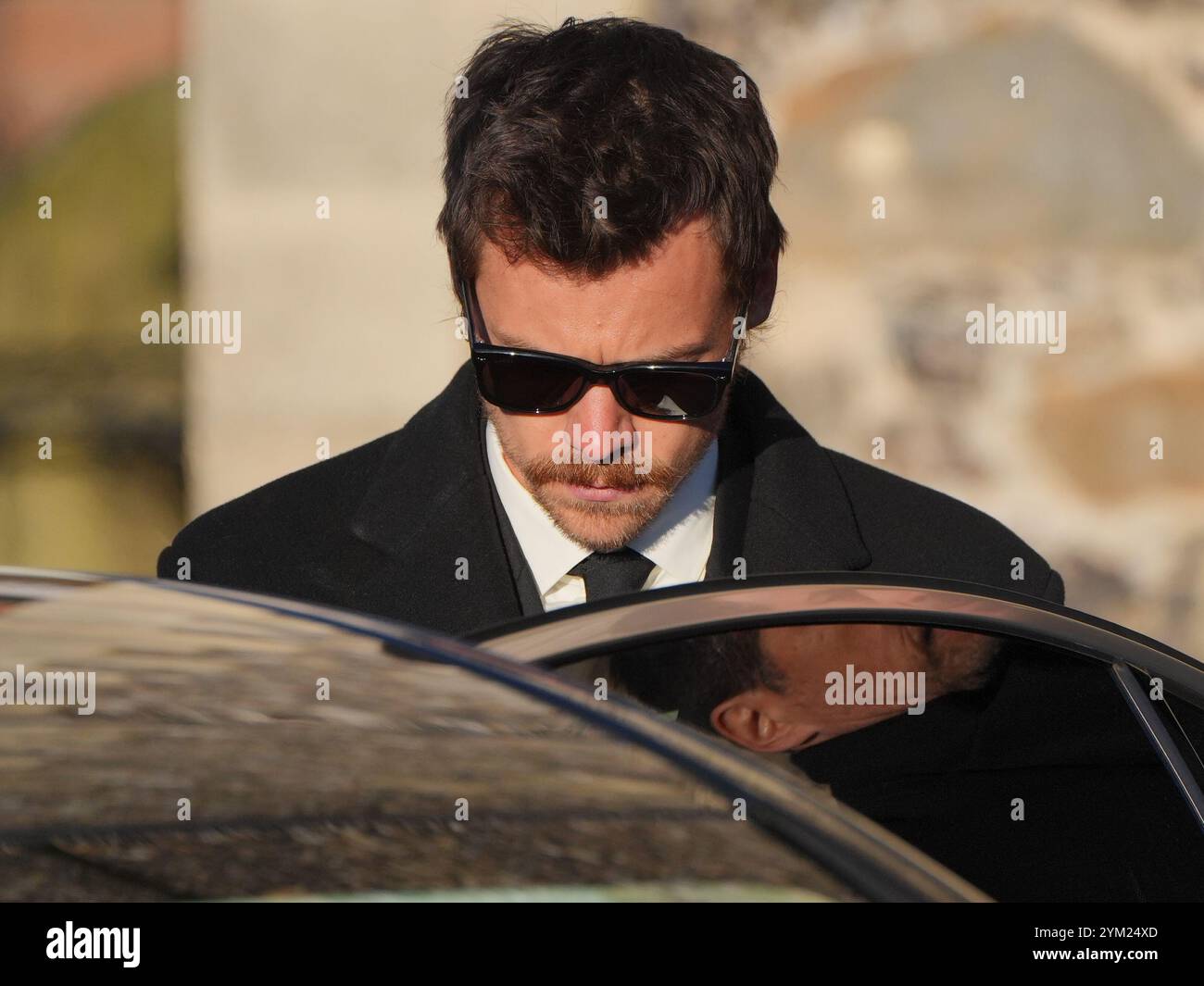 Former One Direction band member Harry Styles after the funeral service ...
