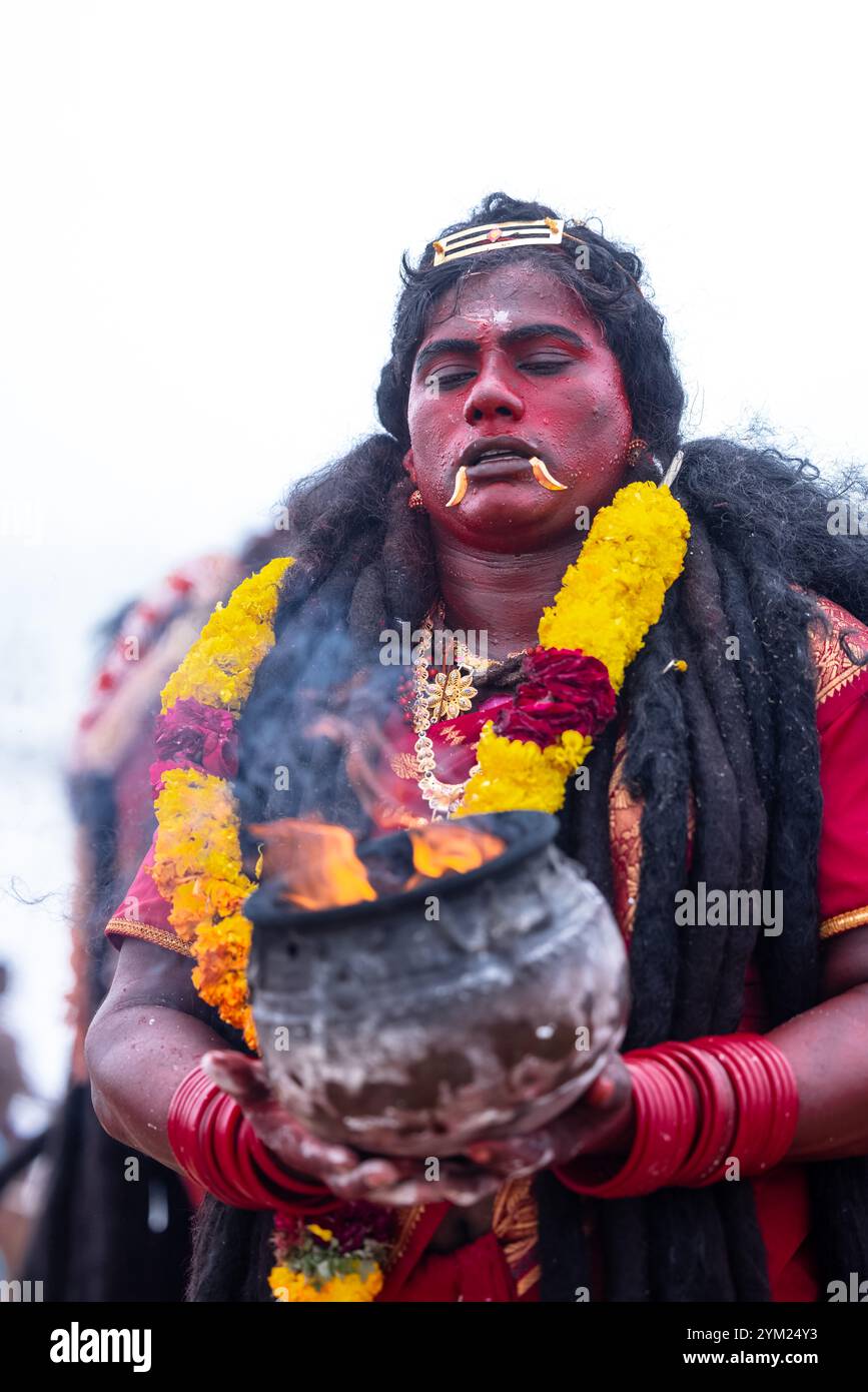 Kulasai Dasara, Portrait of indian hindu devotee with painted face and ...