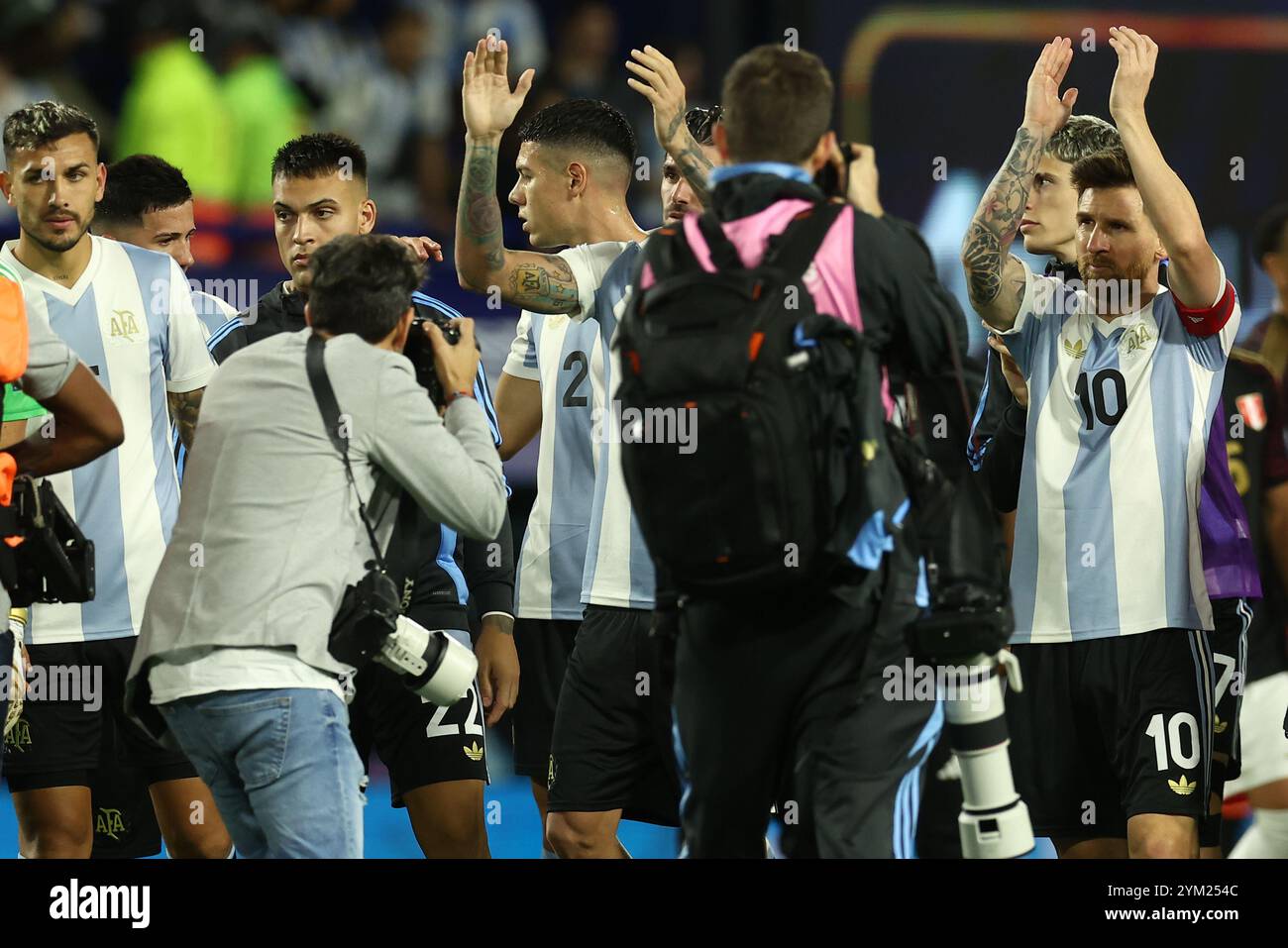 Argentina's forward Lionel Messi (R) claps to supporters after his team ...