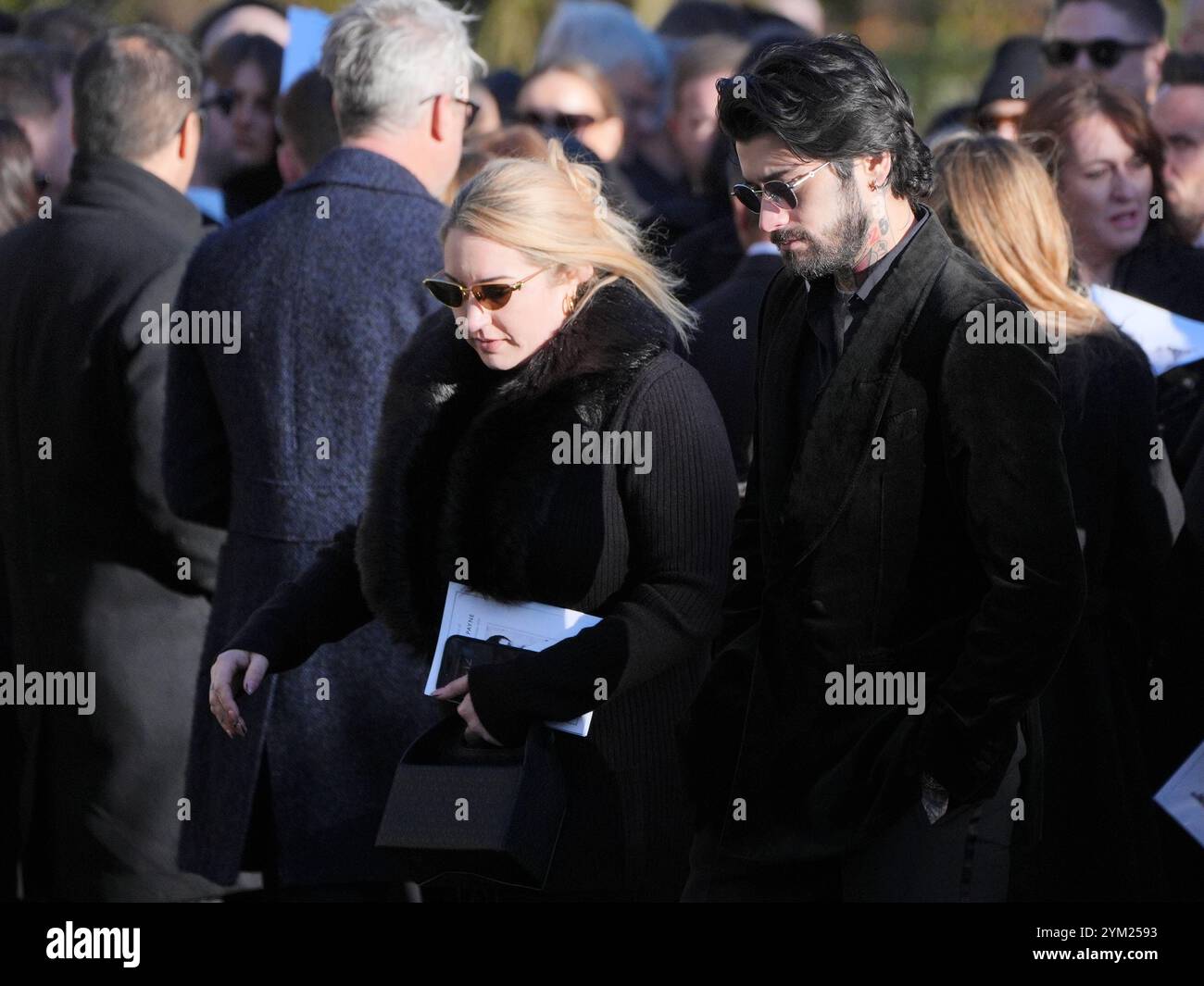 Former One Direction band member Zayn Malik (right) after the funeral ...
