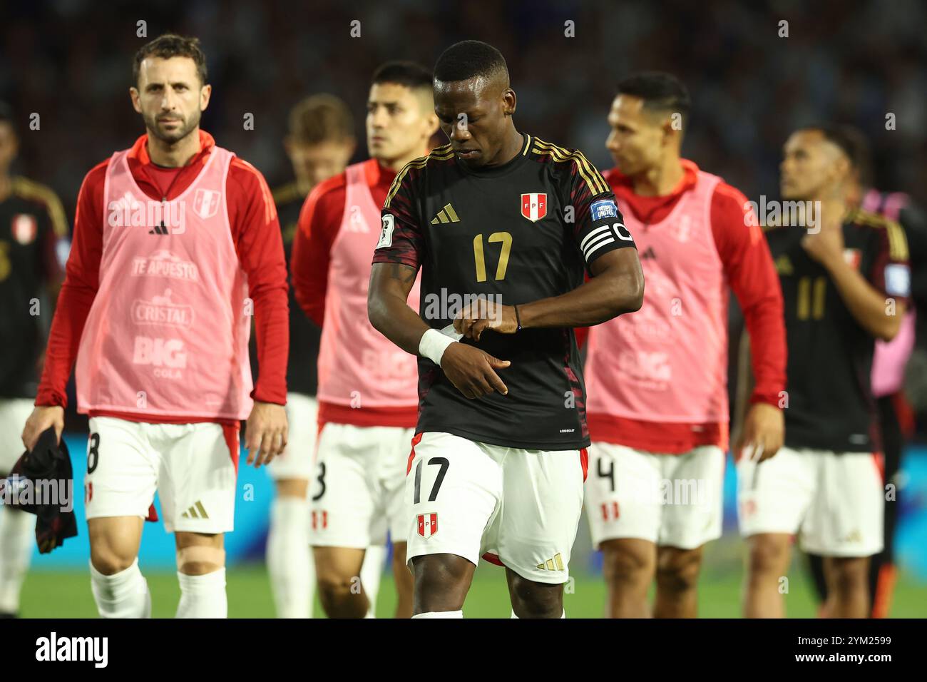 Peru's midfielder Luis Advincula (C) and players gesture after losing 1 ...