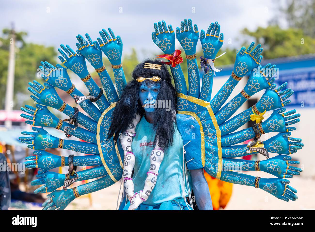 Kulasai Dasara, Portrait of indian hindu devotee with painted face and ...