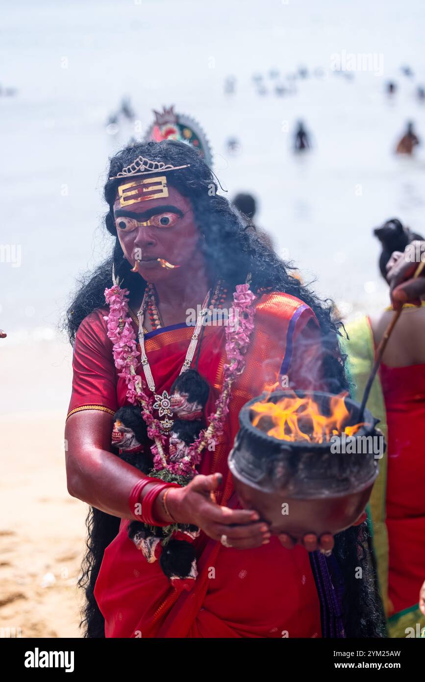 Kulasai Dasara, Portrait of indian hindu devotee with painted face and ...