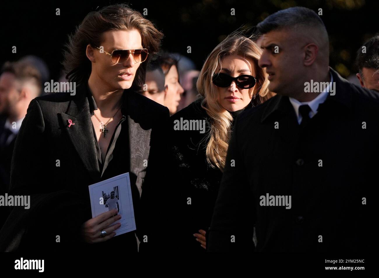 Damian Hurley (left) and Kate Cassidy (centre) after the funeral ...