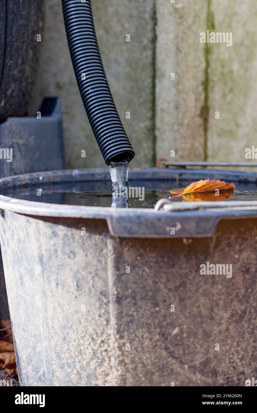 Ice forms at the end of a pipe blocking the flow of water into an ...