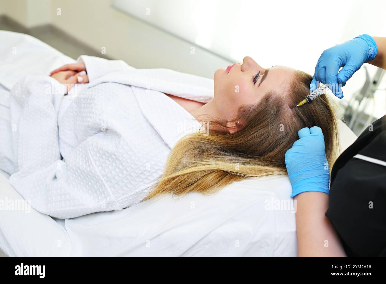 dermatologist cosmetologist performs a mesotherapy procedure and ...