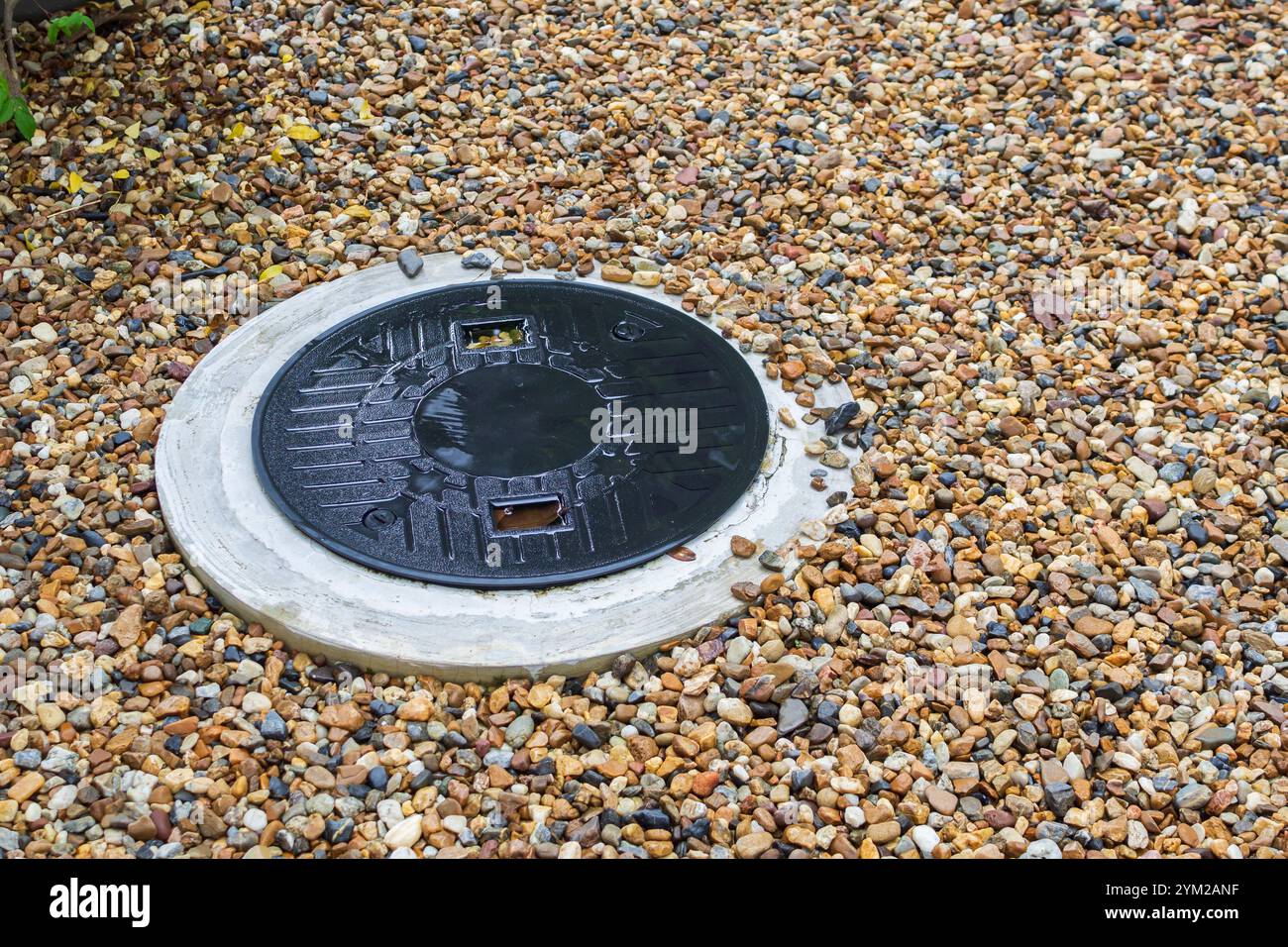 Septic tank cover underground waste treatment system Stock Photo - Alamy