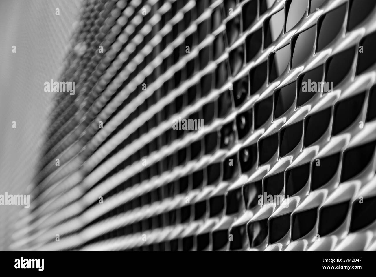 Perforated metal panel close up shot with a perspective, industrial ...