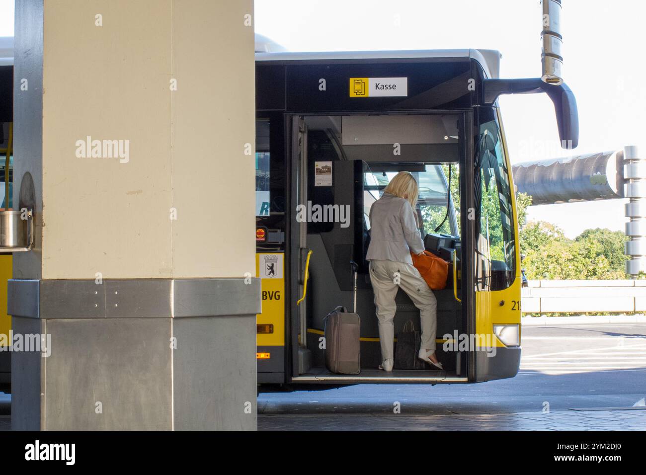 Boarding and paying for a ticket on a bvg bus in Berlin Stock Photo - Alamy